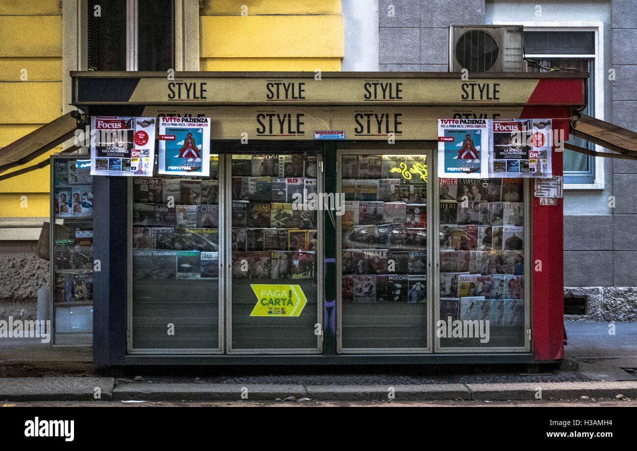 Newsstand which is still closed very early in the morning full of new ...