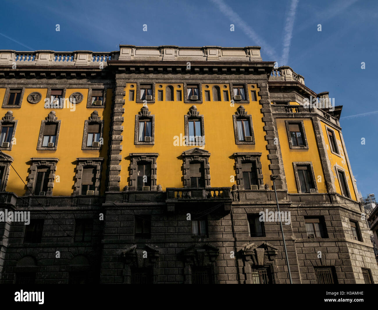 Yellow building with amazing architecture Stock Photo - Alamy