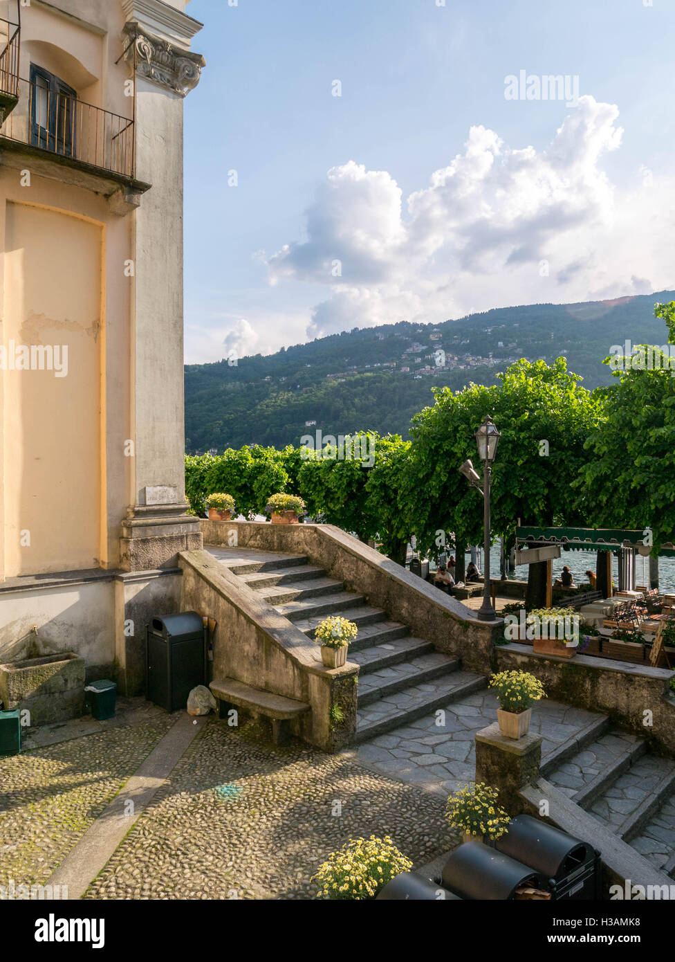 Elegant antique stairs leading to museum with a mountainous landscape ...