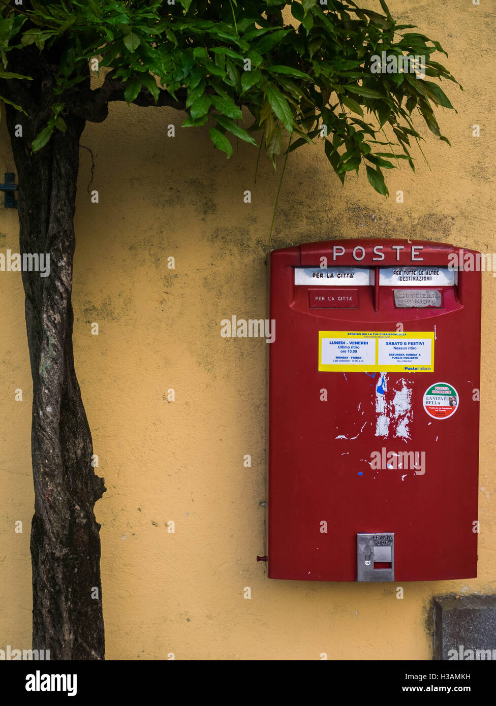 Mail box for post in Italy, red on yellow wall Stock Photo - Alamy