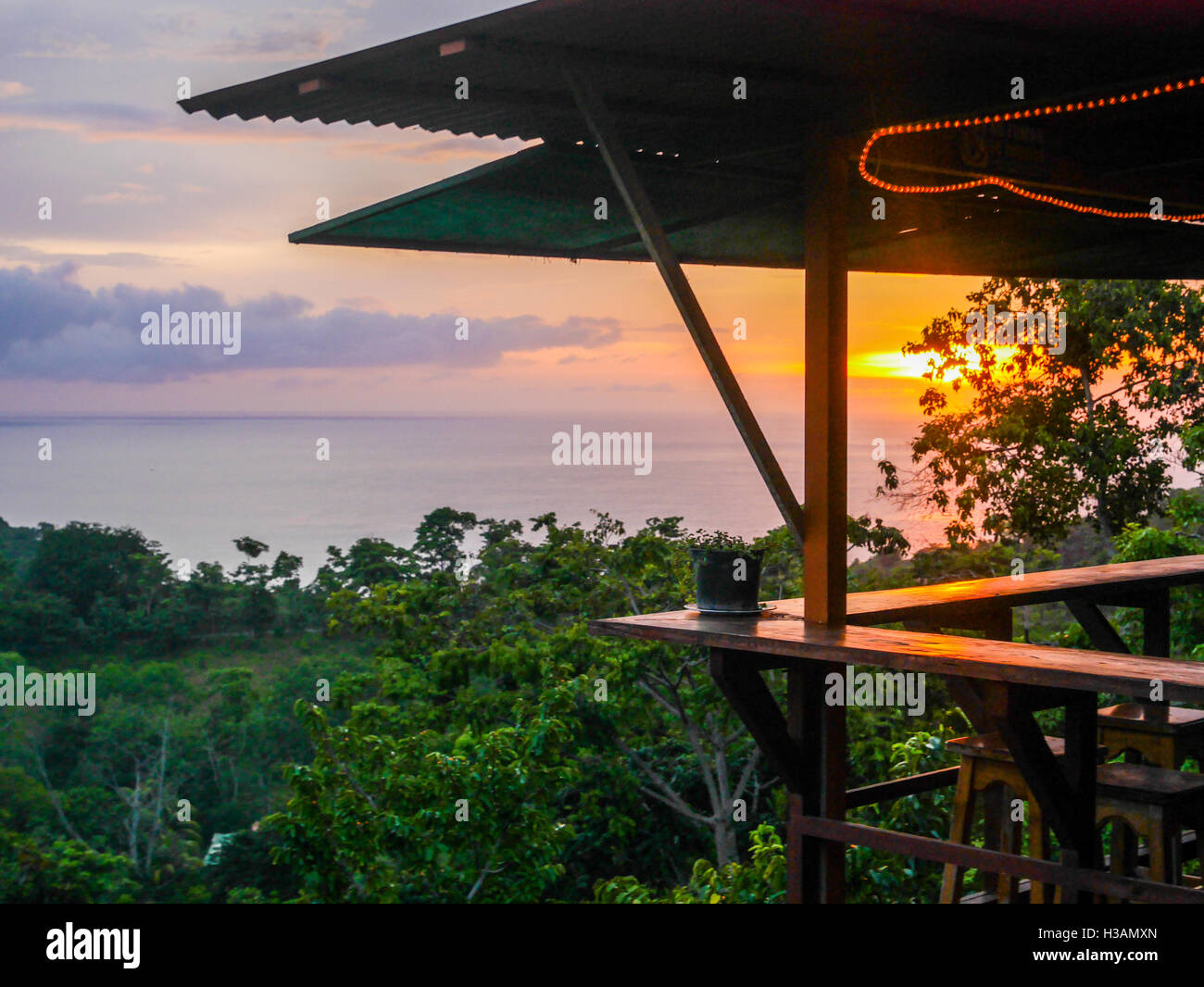 Sun setting into sea Stock Photo - Alamy