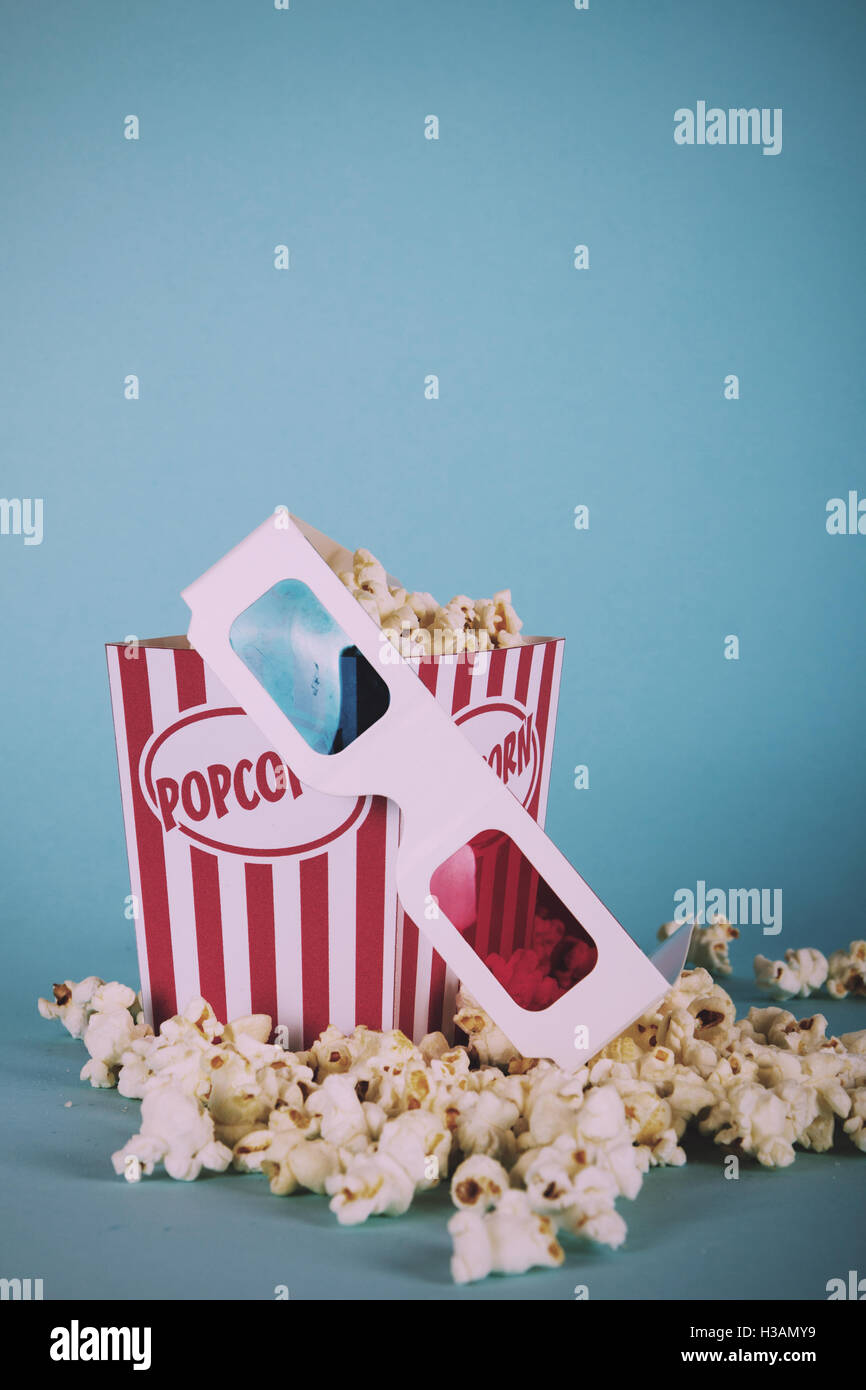 Bucket of popcorn against a blue background Vintage Retro Filter Stock ...