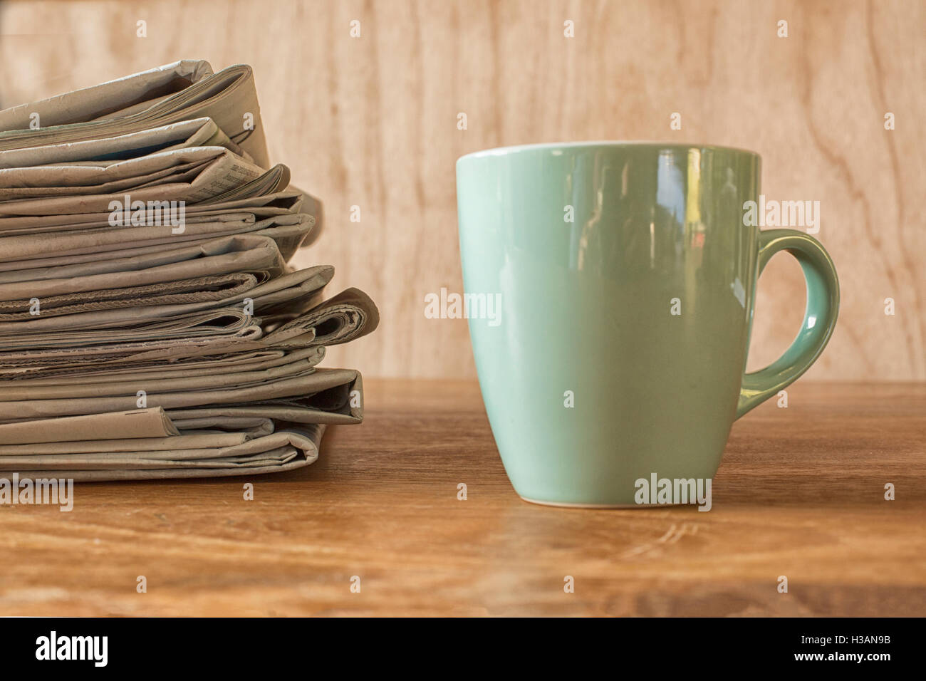 Stack newspapers on coffee table hi-res stock photography and images ...