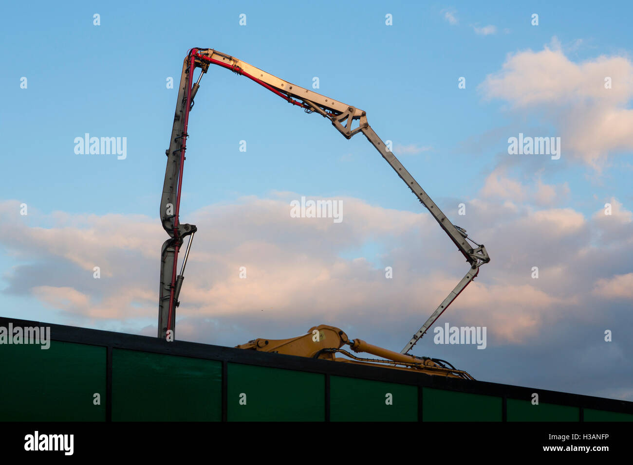 Arm of a large construction site cement pumping machine Stock Photo - Alamy