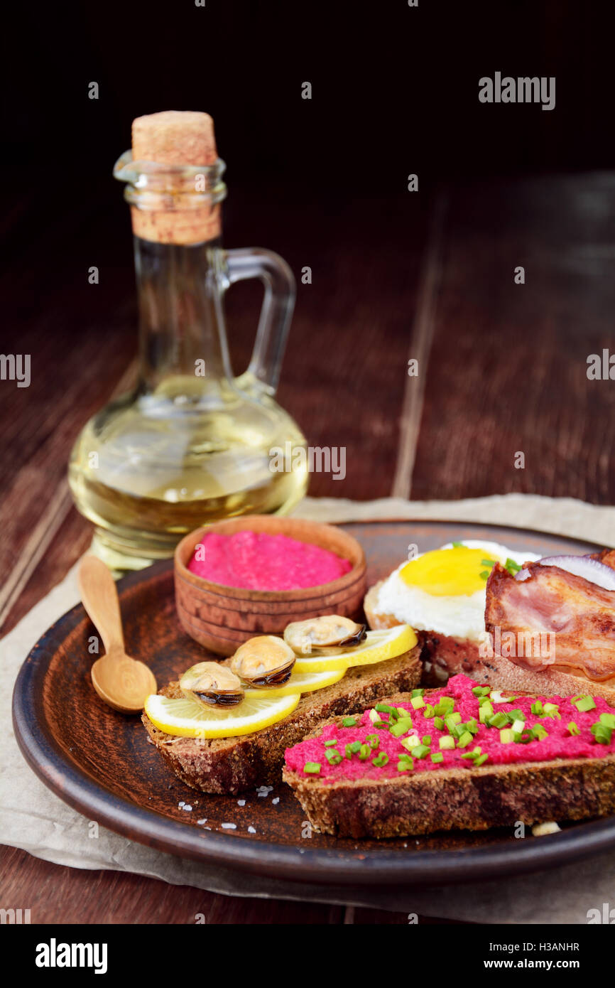 Tasty homemade tapas with different fillings on the table Stock Photo ...