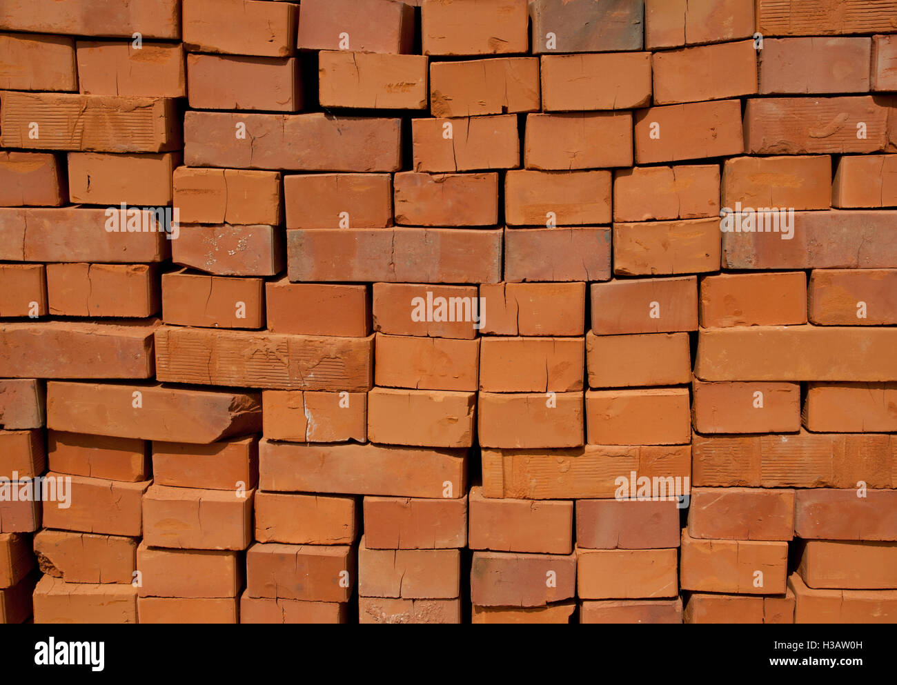 lots of some orange bricks creating an orange texture Stock Photo - Alamy