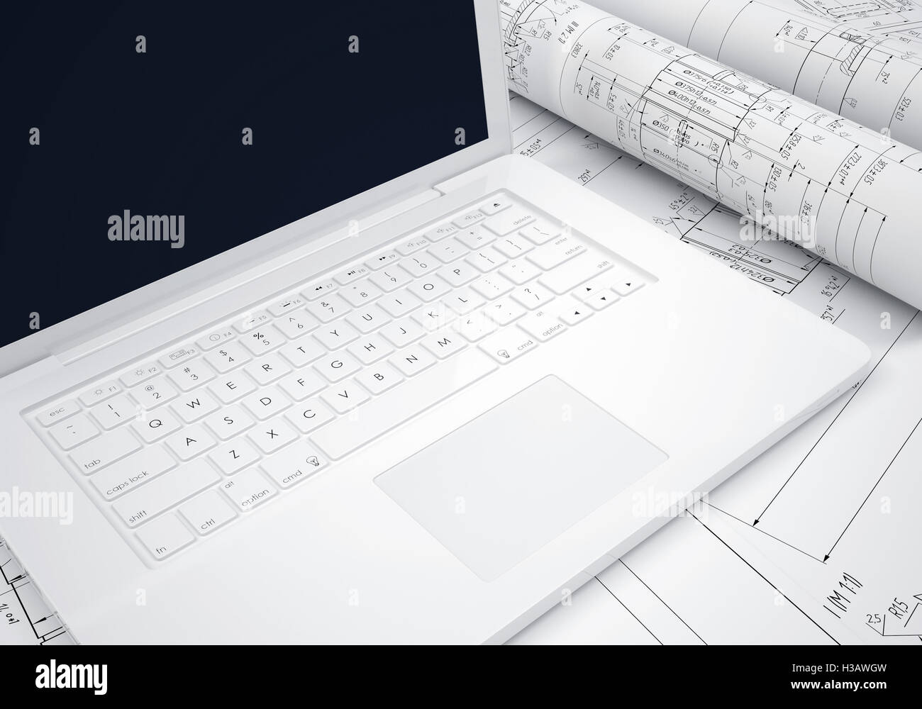 Scrolls engineering drawings and laptop Stock Photo - Alamy