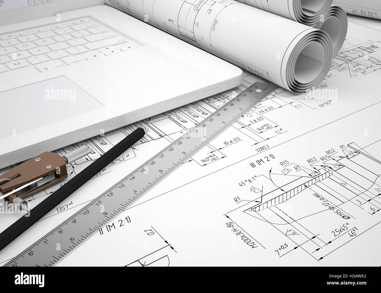 Scrolls engineering drawings and laptop Stock Photo - Alamy