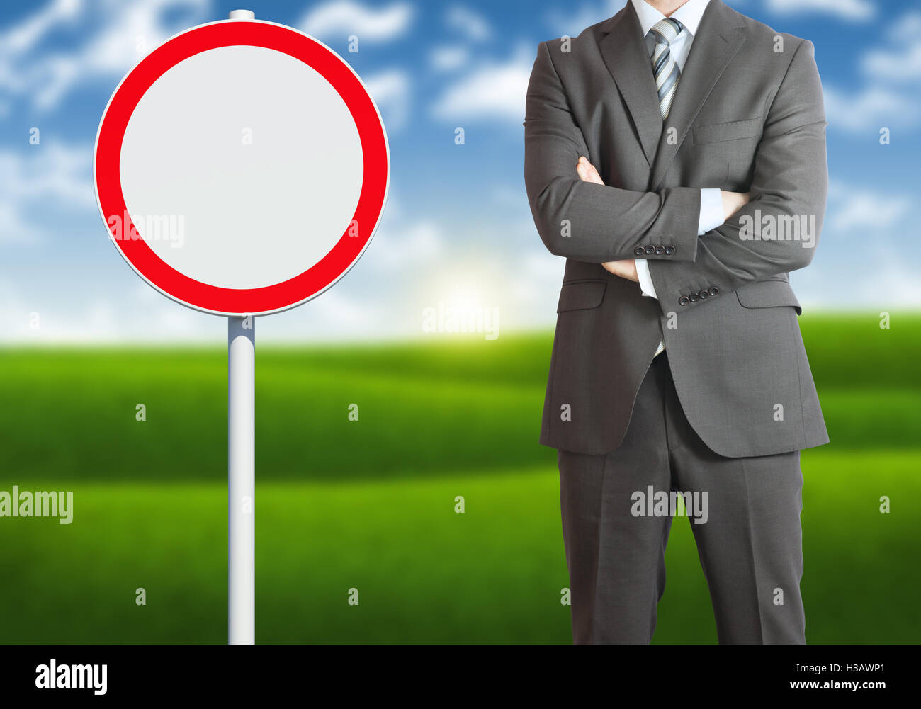 Businessman with road sign Stock Photo - Alamy