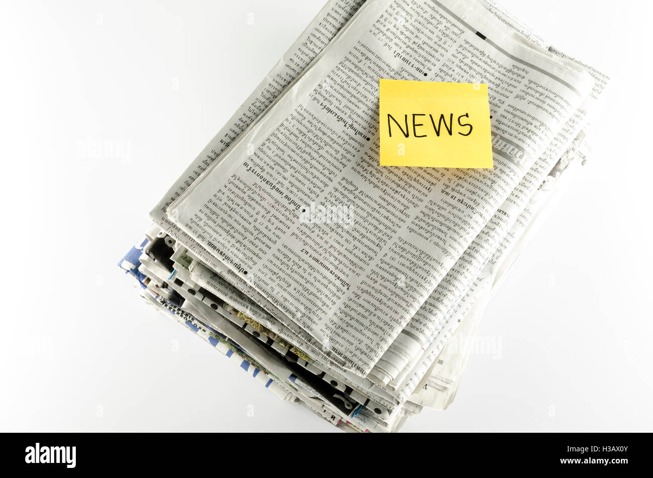 stack of newspaper with post it write news word Stock Photo - Alamy