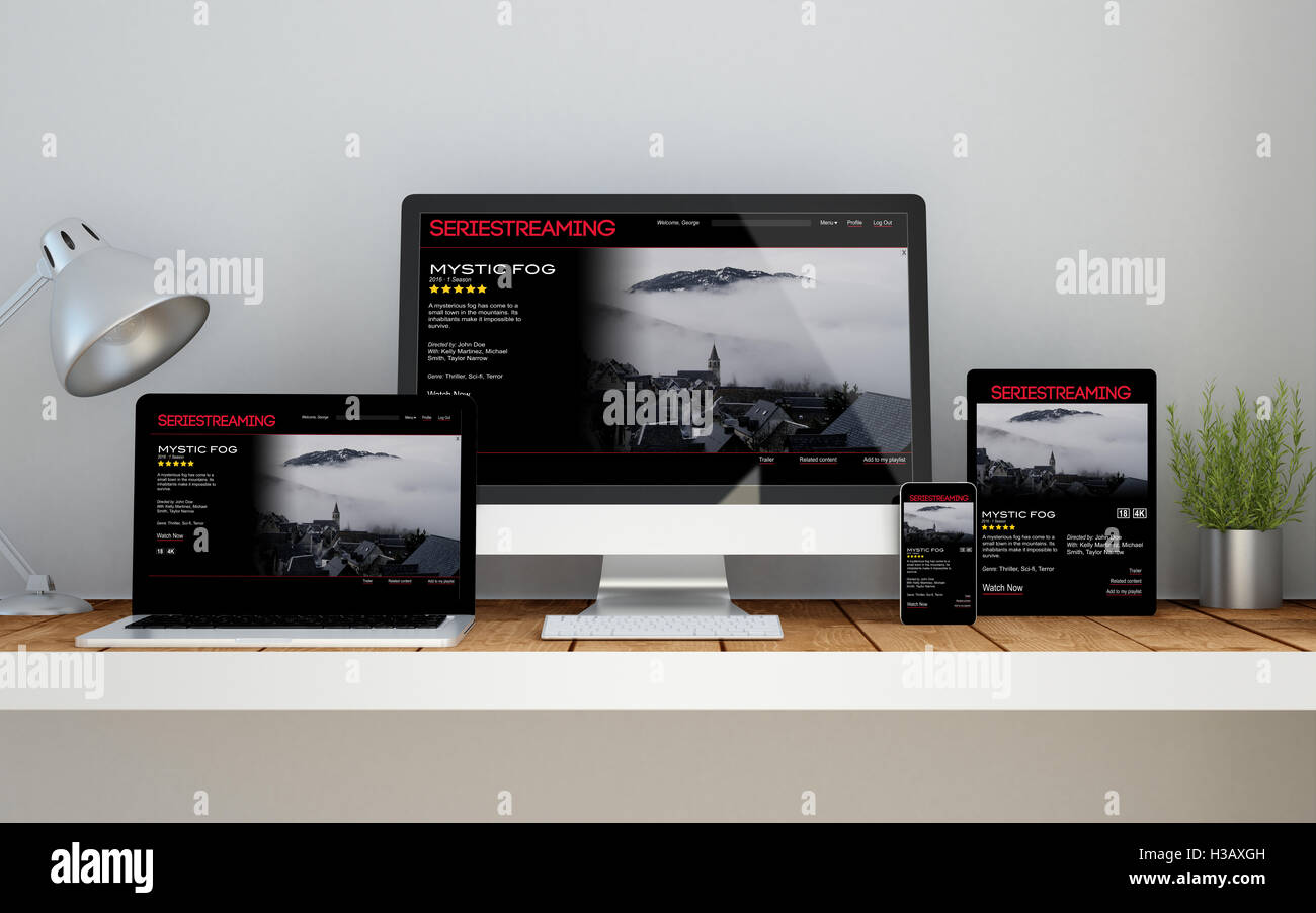 A computer, laptop, smartphone and tablet on a desktop workspace with ...