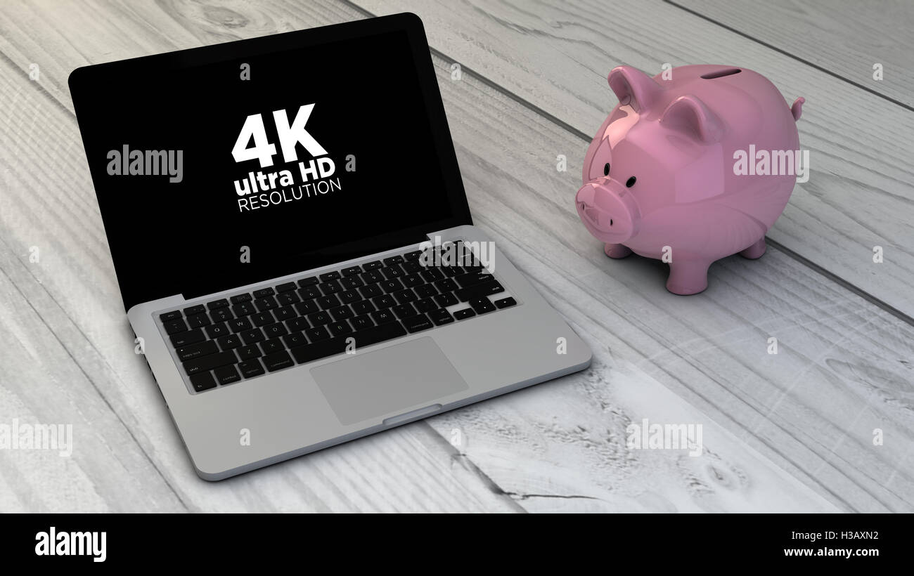 businnes concept: piggybank and 4k resolution screen laptop over wooden ...