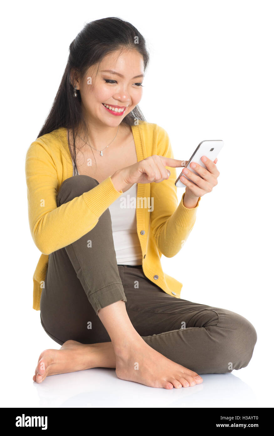 Asian female texting Stock Photo - Alamy