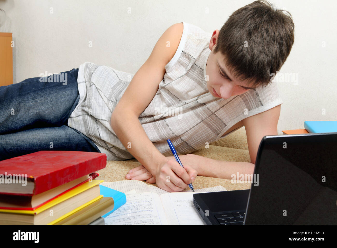Teenager doing Homework Stock Photo - Alamy