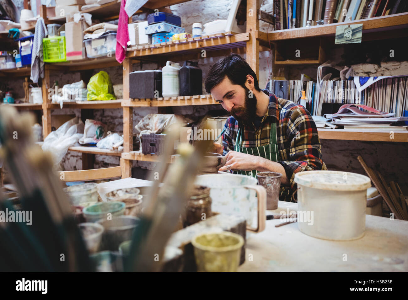 Male potter working Stock Photo - Alamy