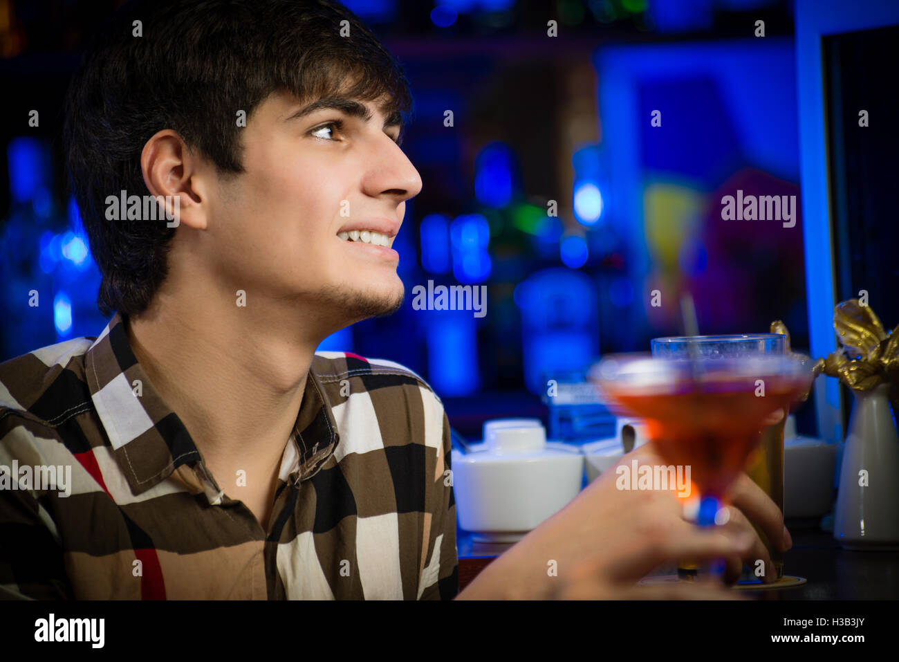 portrait of a young man at the bar Stock Photo - Alamy