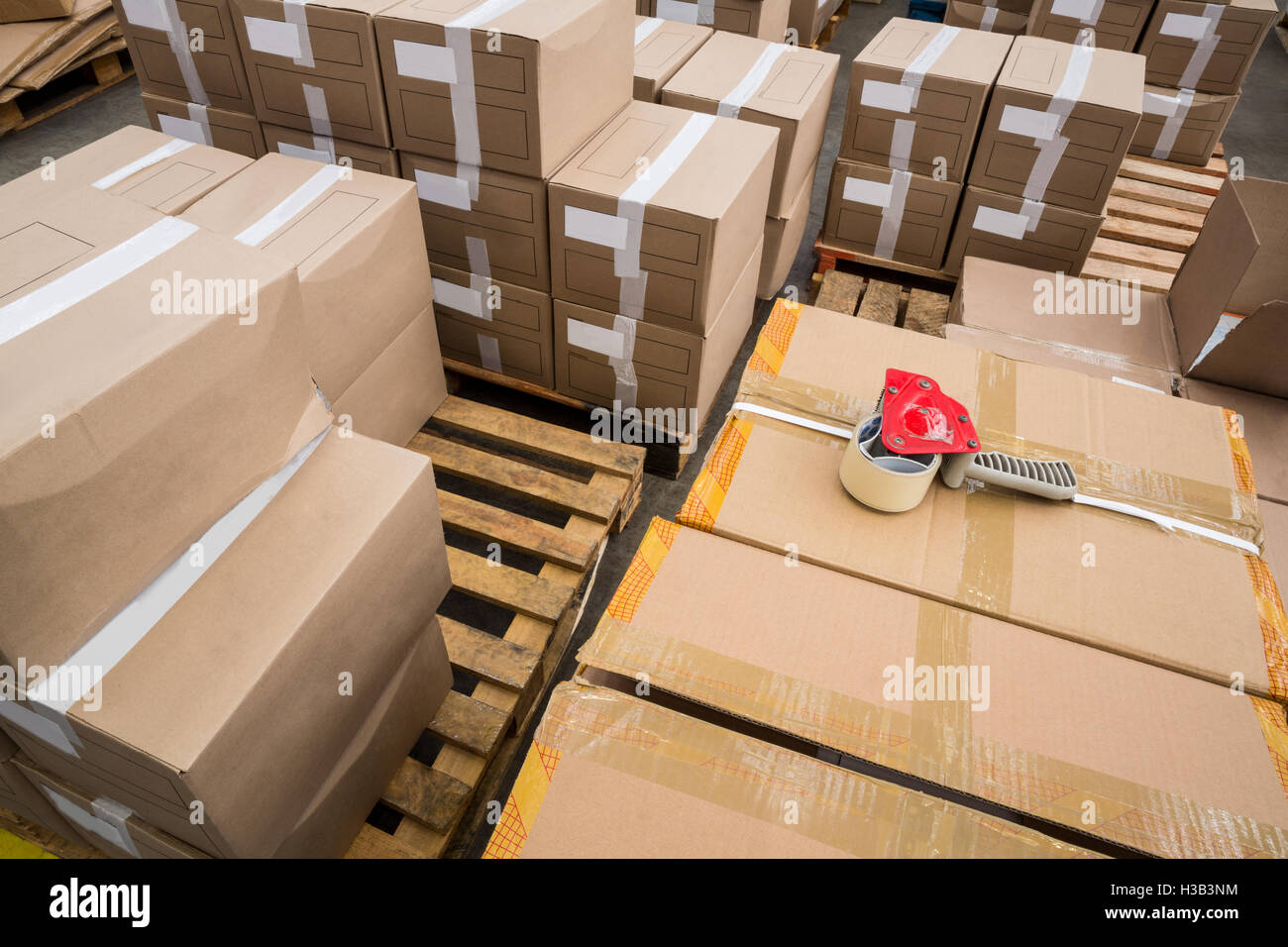 Cardboard boxes in warehouse Stock Photo - Alamy