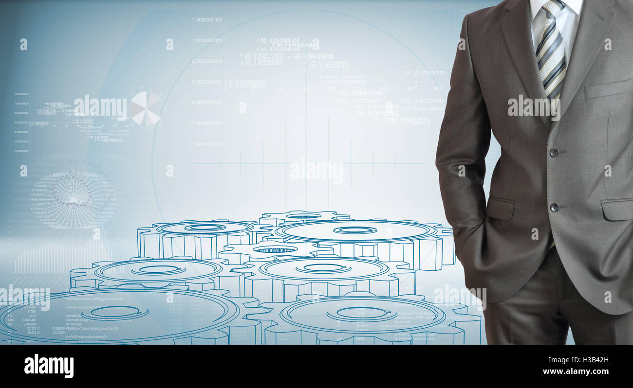 Businessman with high-tech gears and graphs Stock Photo - Alamy