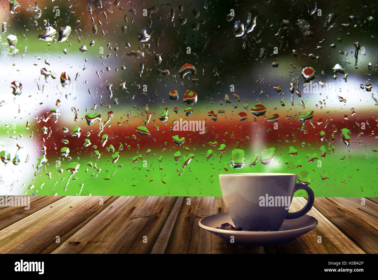 cup of coffee on rainy window Stock Photo - Alamy