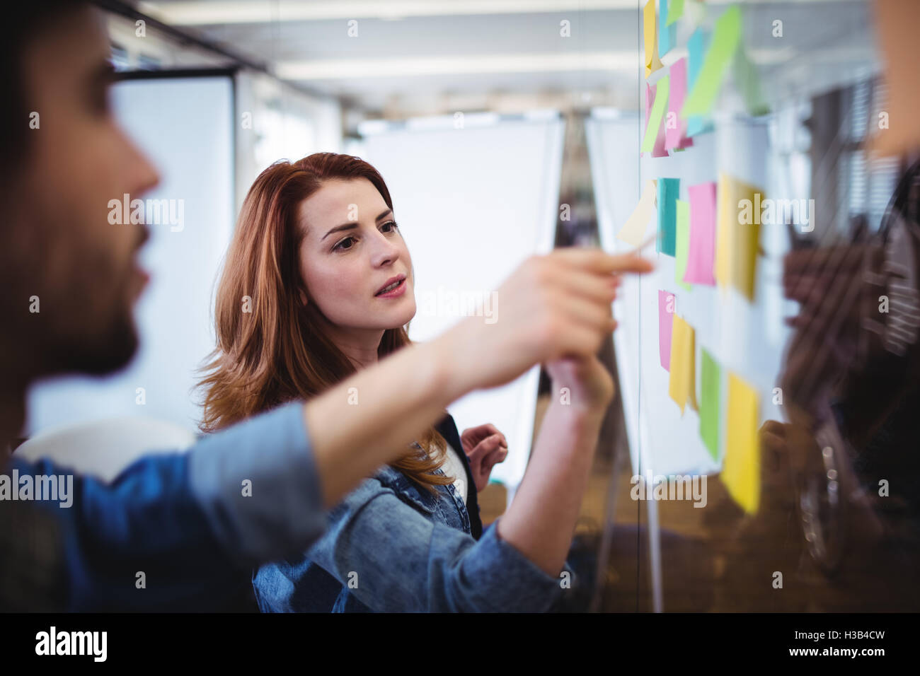 Coworkers writing hi-res stock photography and images - Alamy