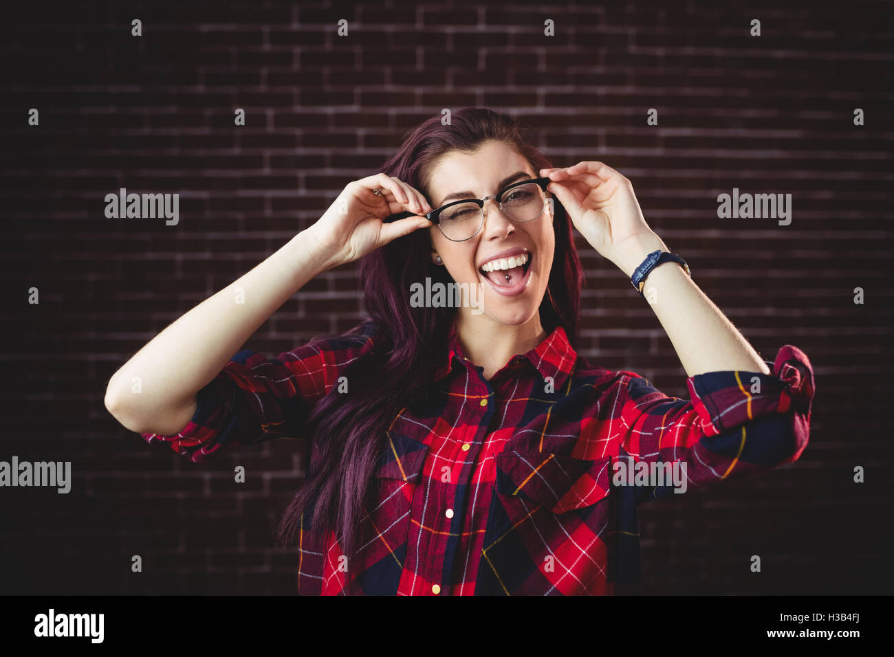 Young woman cheering Stock Photo - Alamy