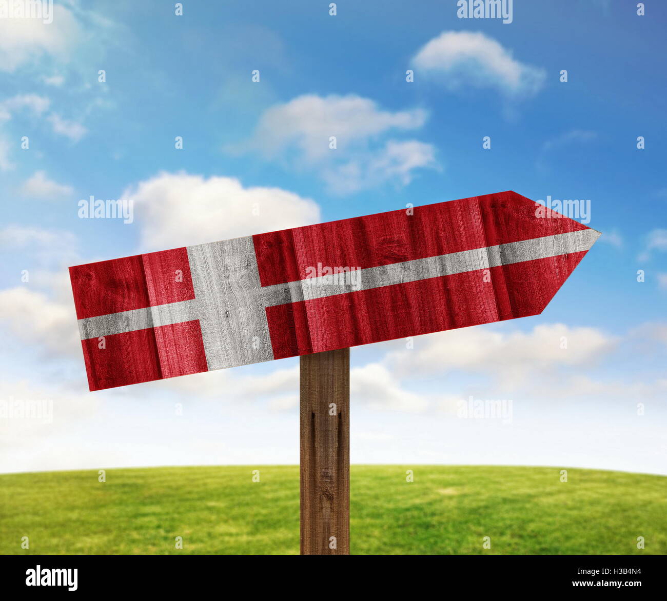 Denmark wooden direction sign on nature background Stock Photo - Alamy