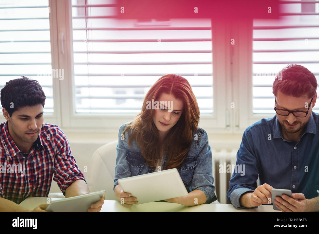 Business people working electronic devices Stock Photo - Alamy