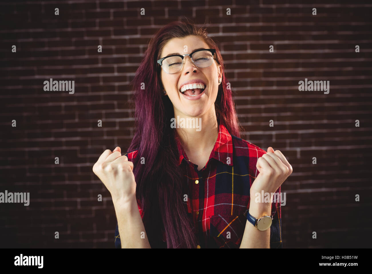 Young woman cheering Stock Photo - Alamy