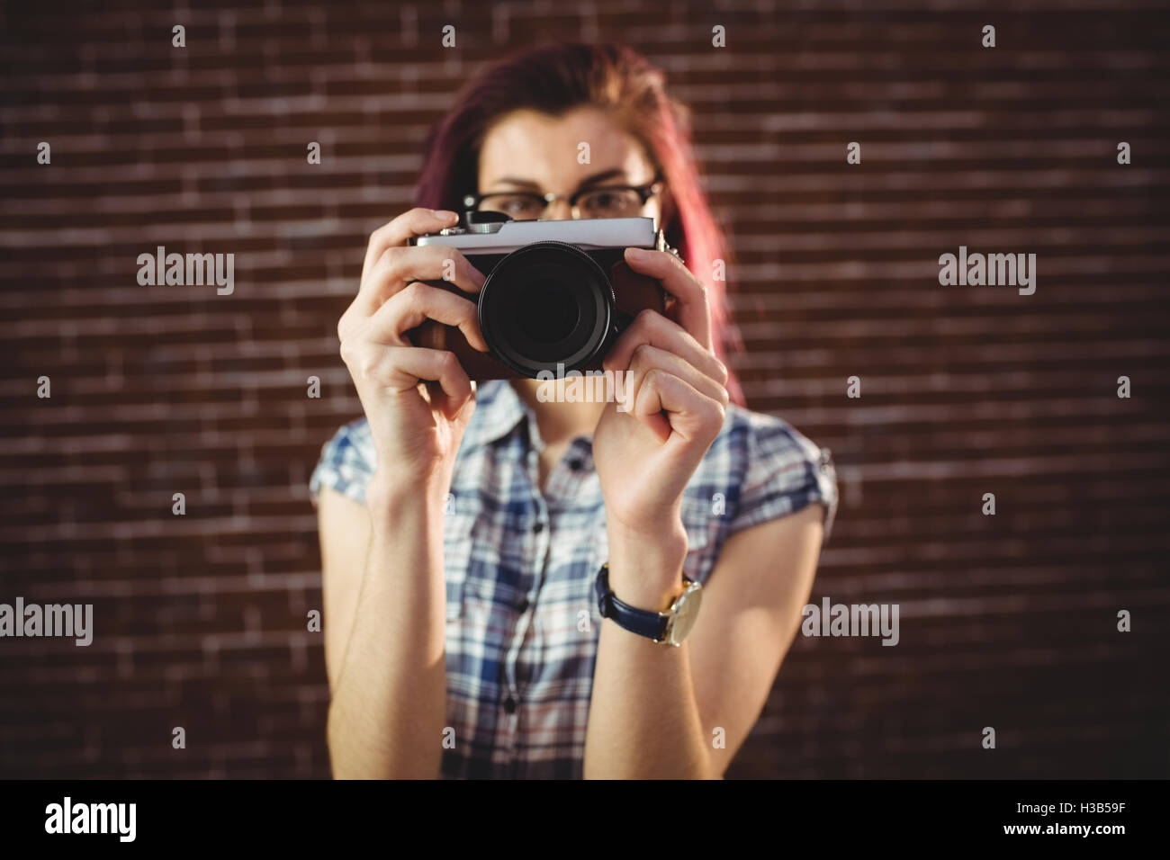 Beautiful woman taking a picture Stock Photo - Alamy