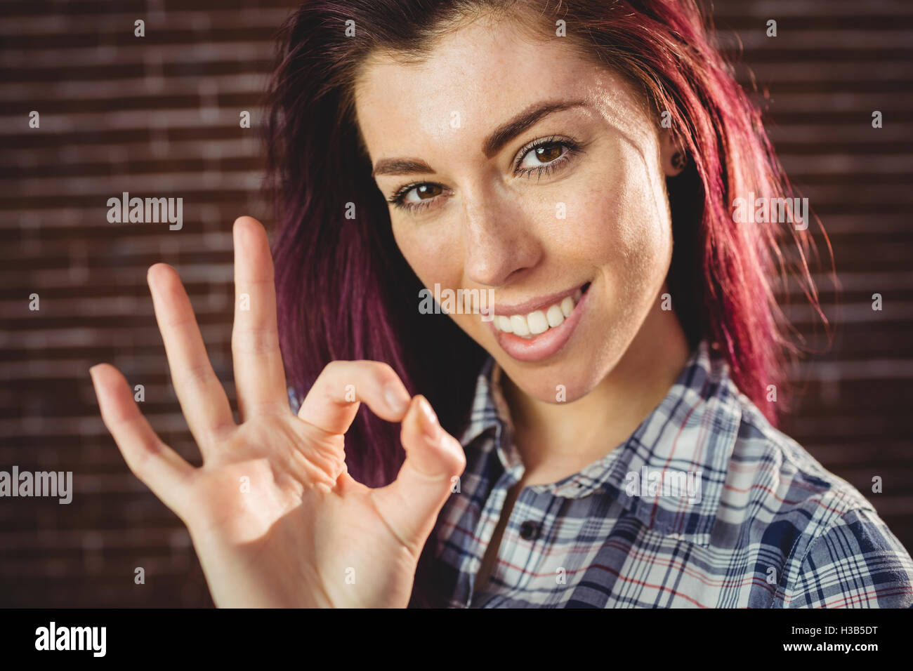Woman winking and smiling hi-res stock photography and images - Alamy