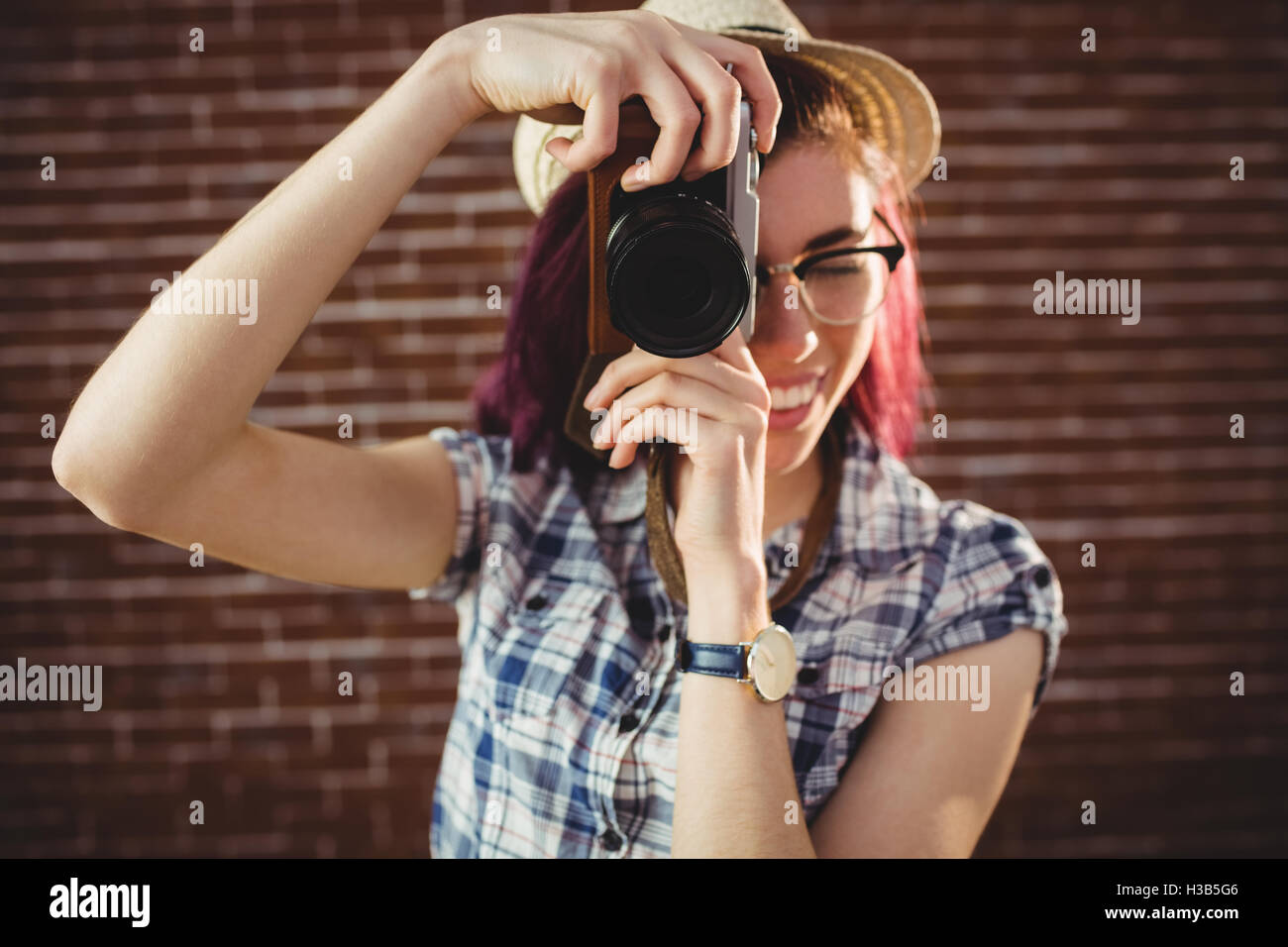 Beautiful woman taking a picture Stock Photo - Alamy