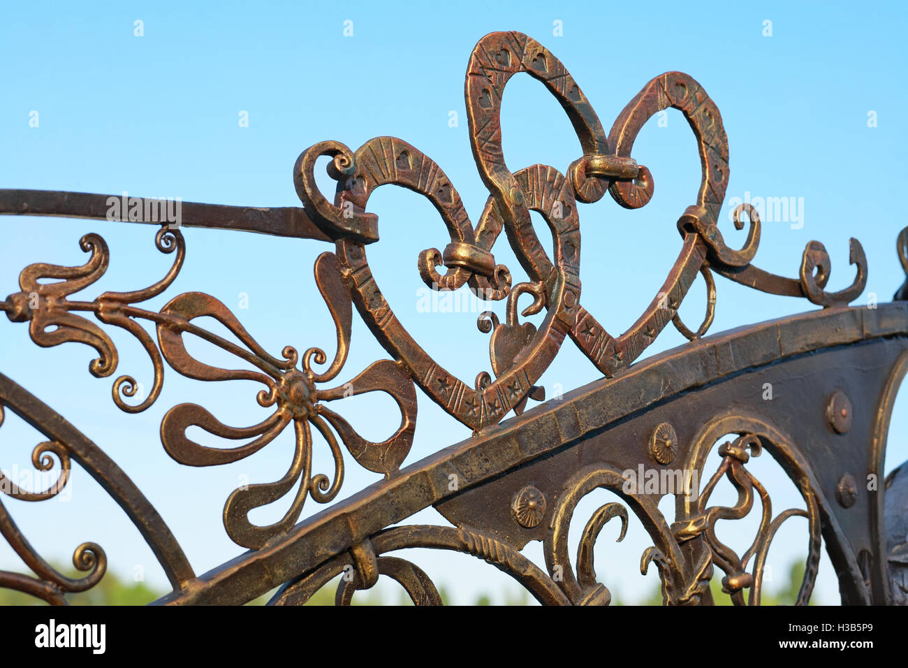 Forged fence, wrought iron hearts on the fence Stock Photo - Alamy