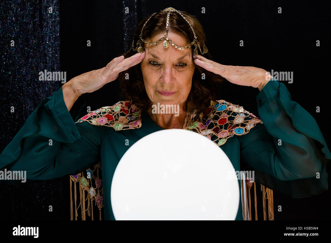 Fortune teller with crystal ball Stock Photo - Alamy