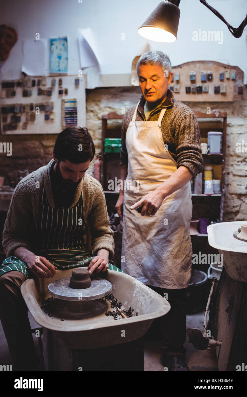 Male craftsperson with colleague Stock Photo - Alamy