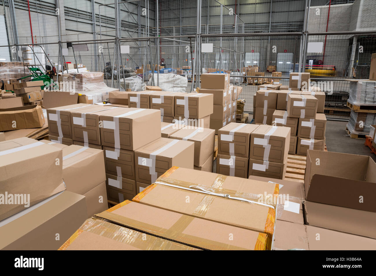Cardboard boxes in warehouse Stock Photo - Alamy