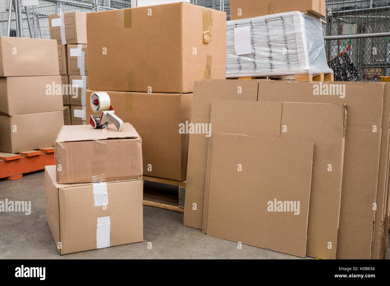 Cardboard boxes in warehouse Stock Photo - Alamy