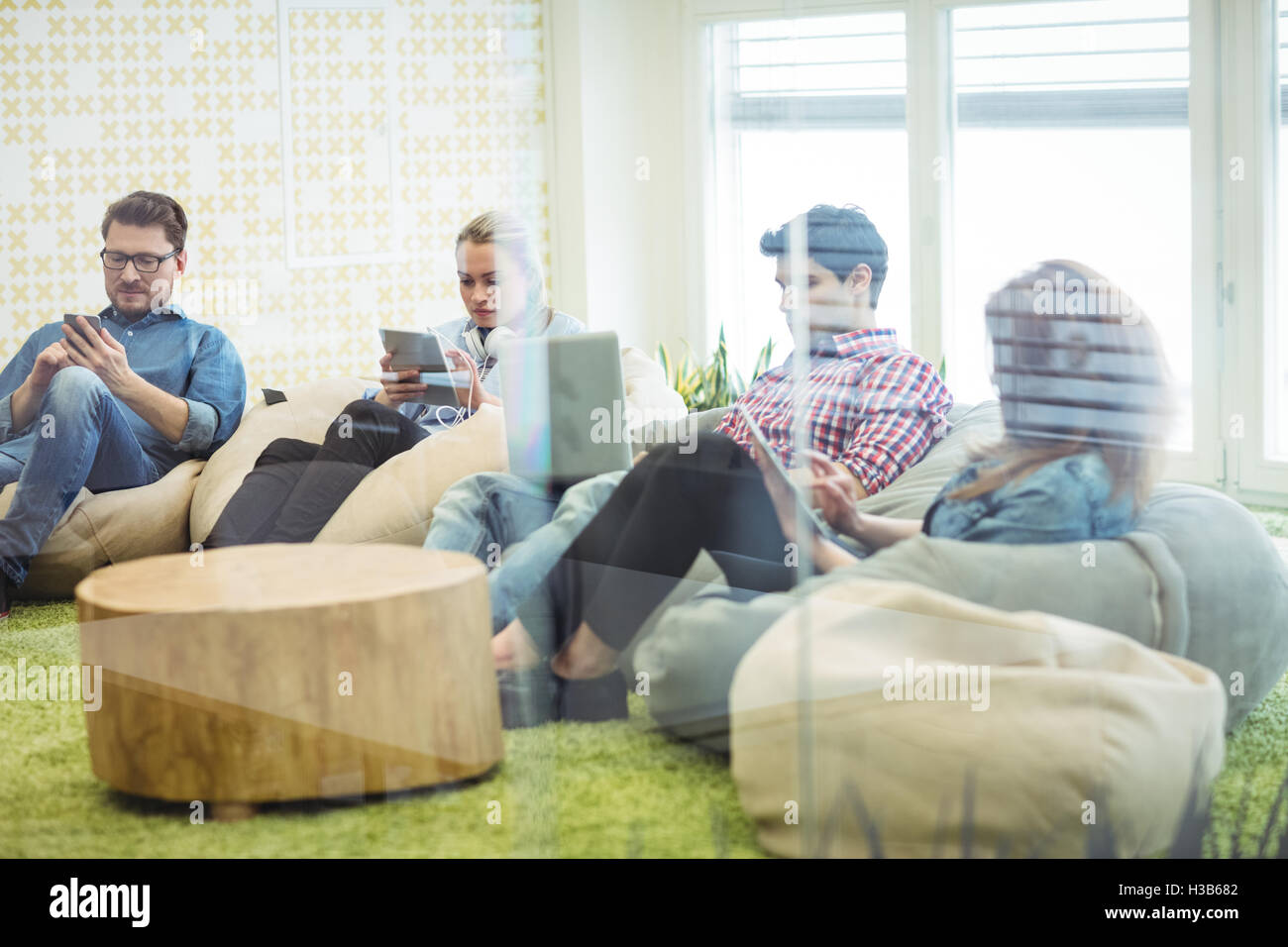 Creative business people using technologies Stock Photo - Alamy