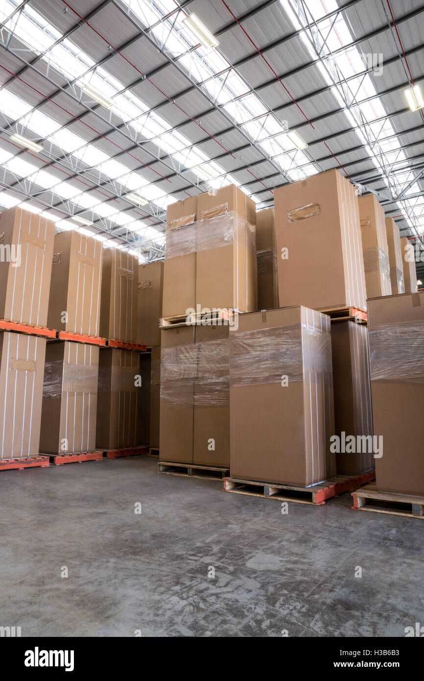 Cardboard boxes in warehouse Stock Photo - Alamy