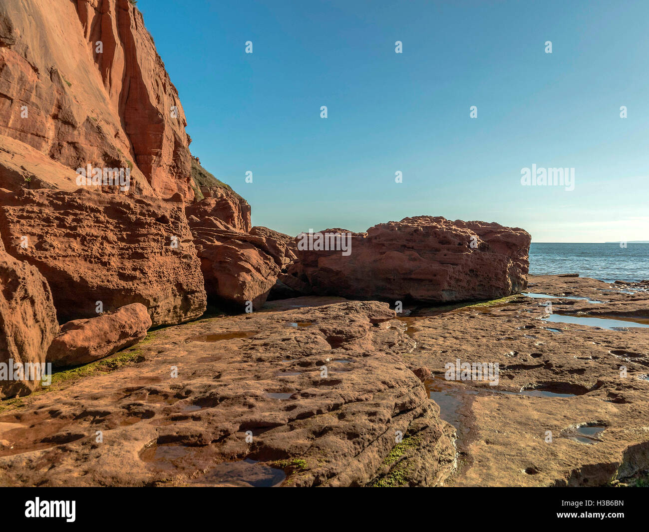 Beautiful rustic rock formation at low tide along the Jurassic Coast ...
