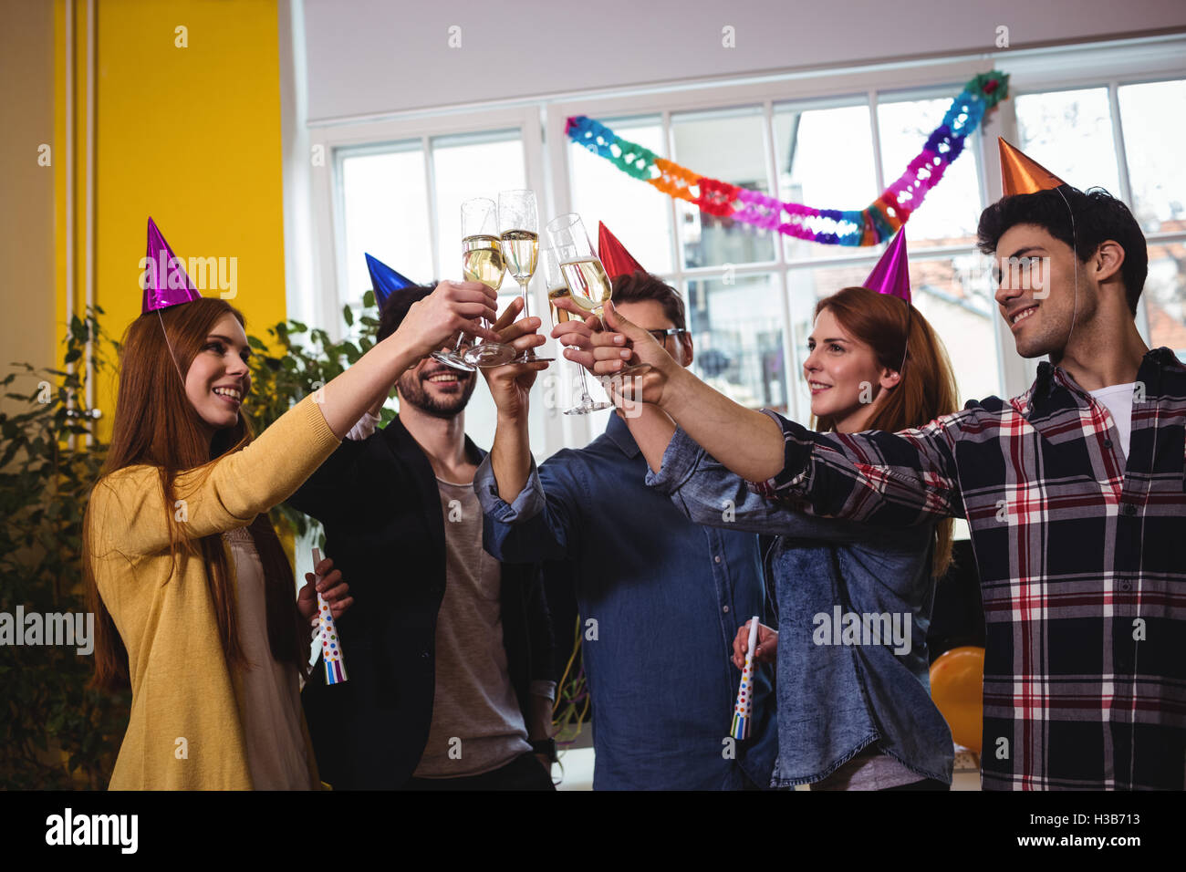 Creative business people toasting drink Stock Photo - Alamy