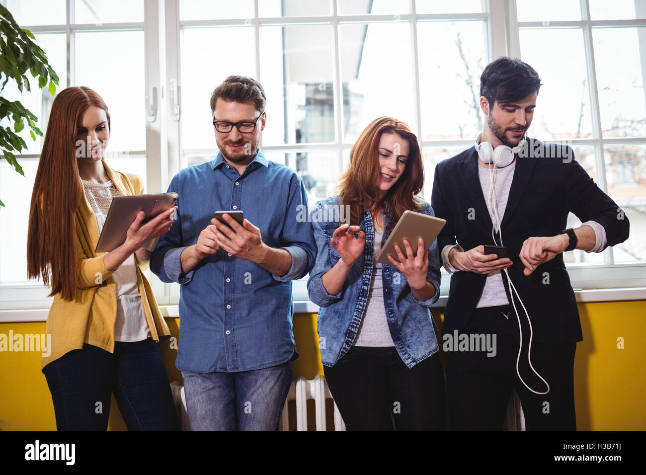 Stylish business people using technologies Stock Photo - Alamy