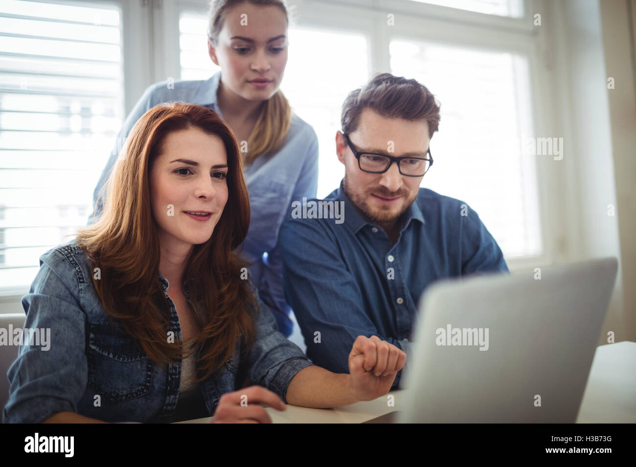 Coworkers thinking hi-res stock photography and images - Alamy