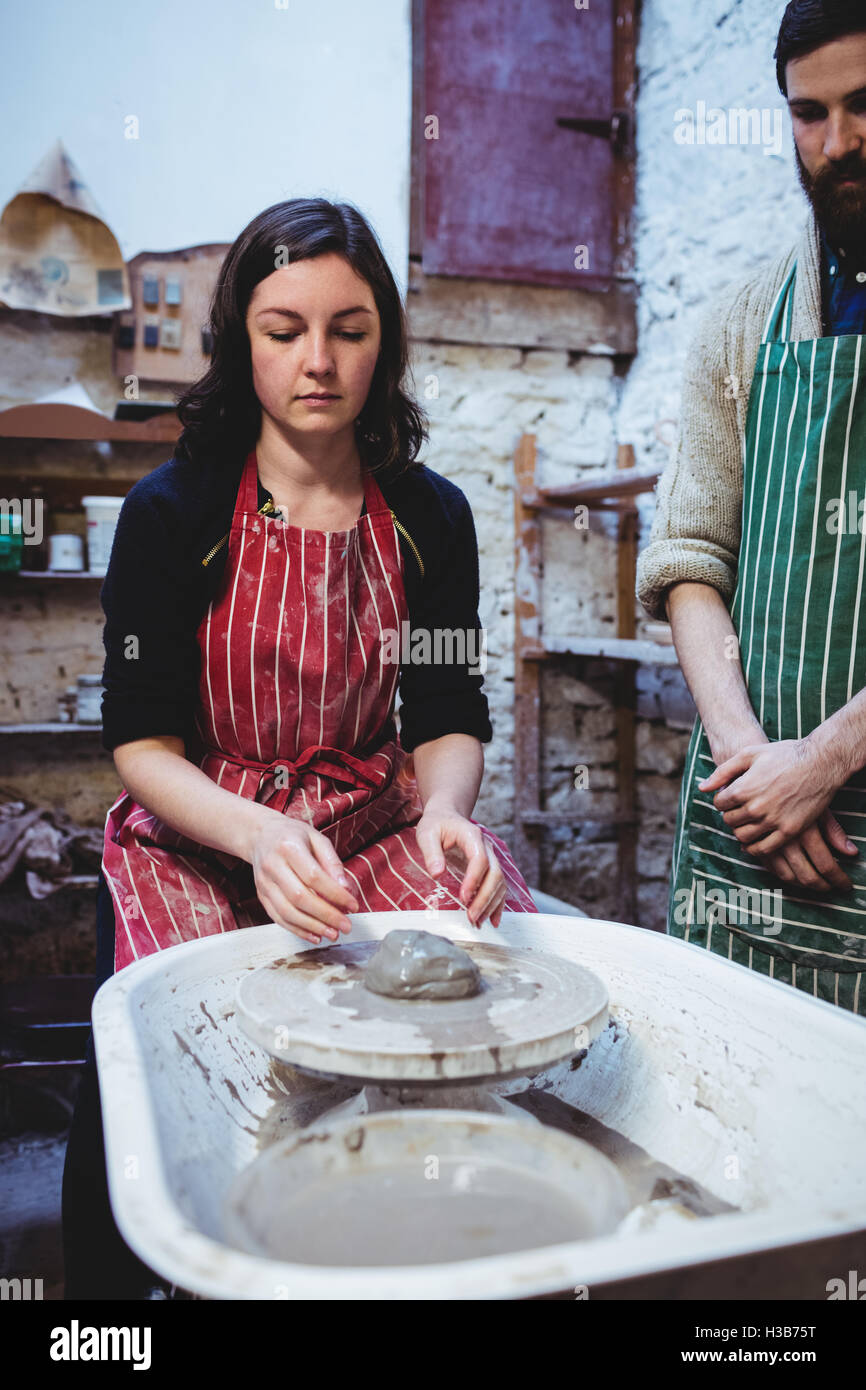 Female potter with colleague working Stock Photo - Alamy