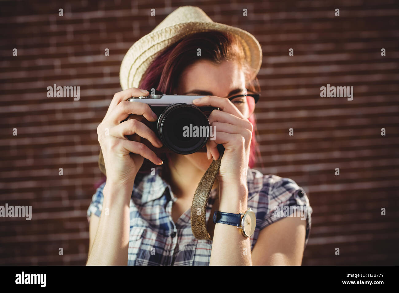 Beautiful woman taking a picture Stock Photo - Alamy