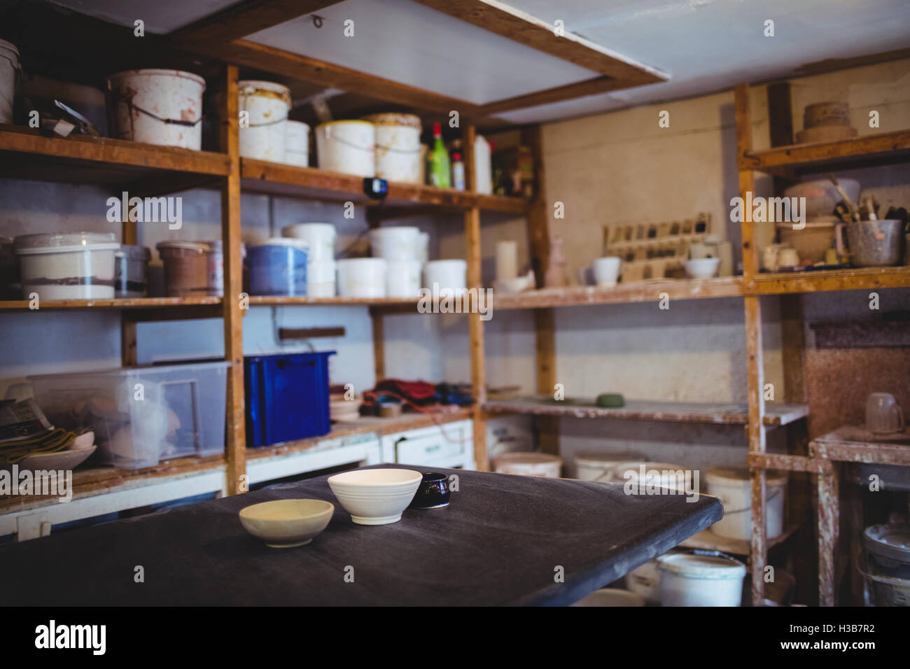 Container on shelves at workshop Stock Photo - Alamy