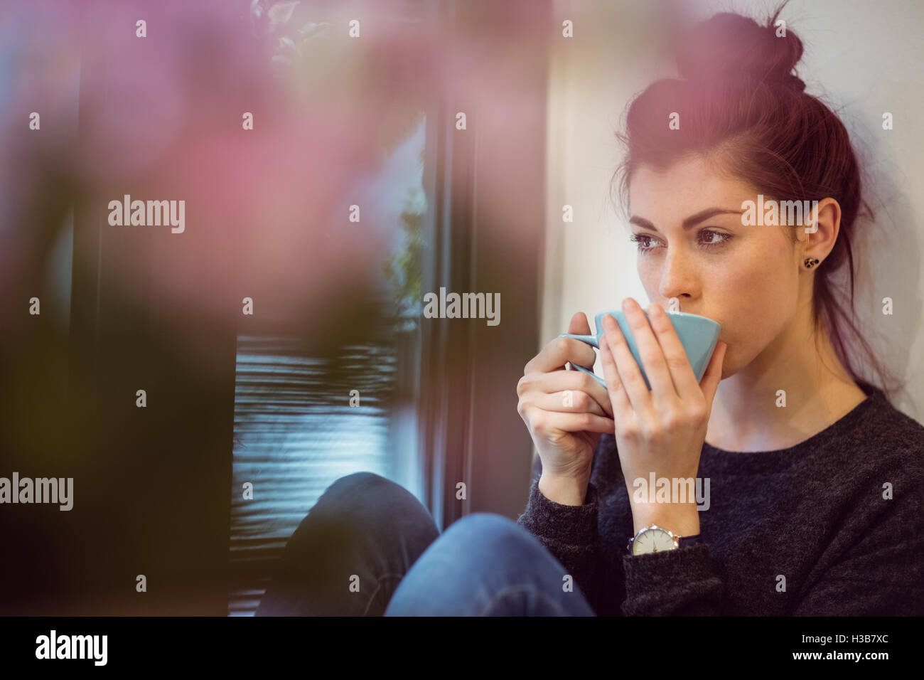 Hipster drinking a cup of coffee Stock Photo - Alamy