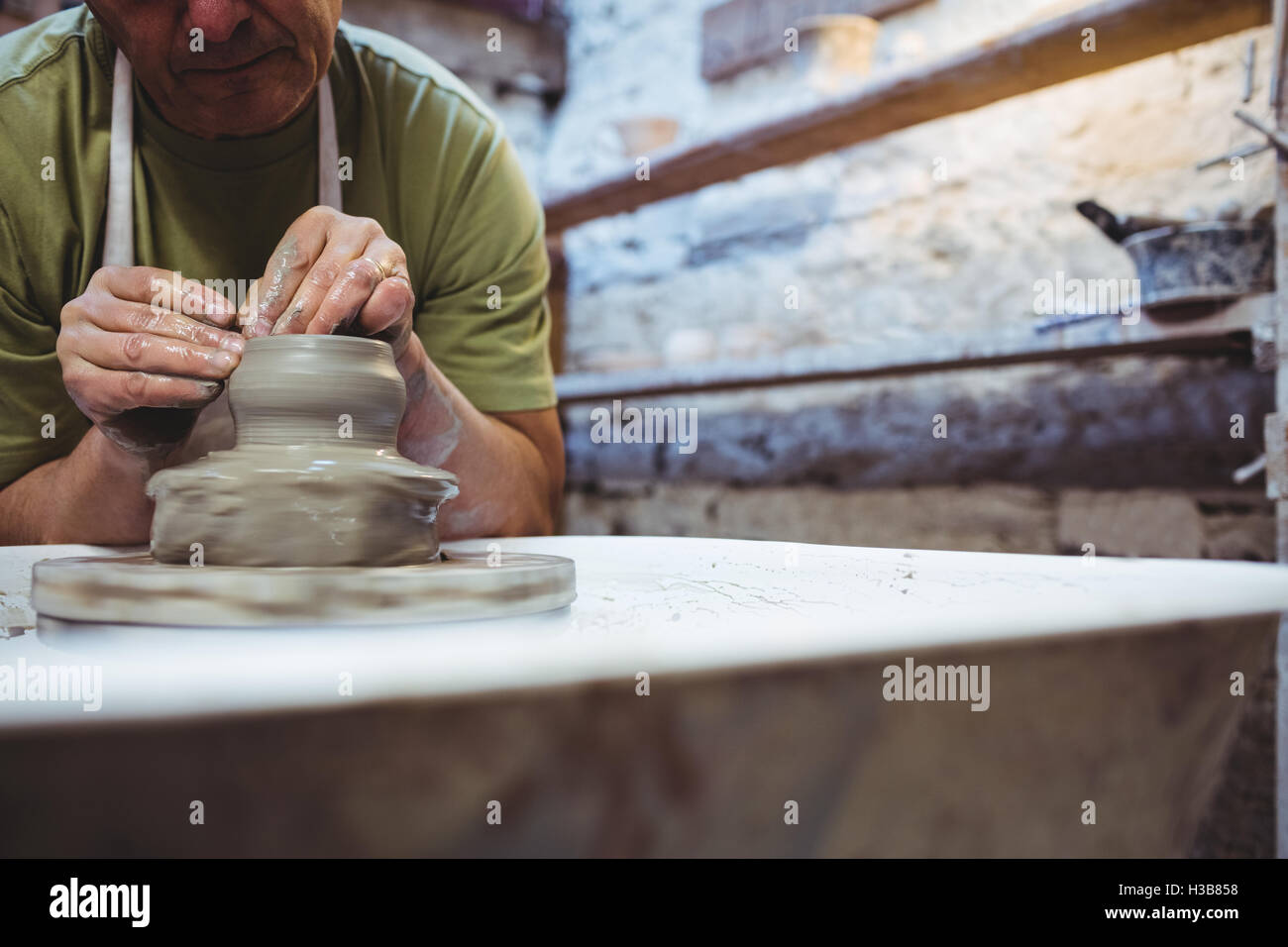 Caucasian male potter making ceramic hi-res stock photography and ...