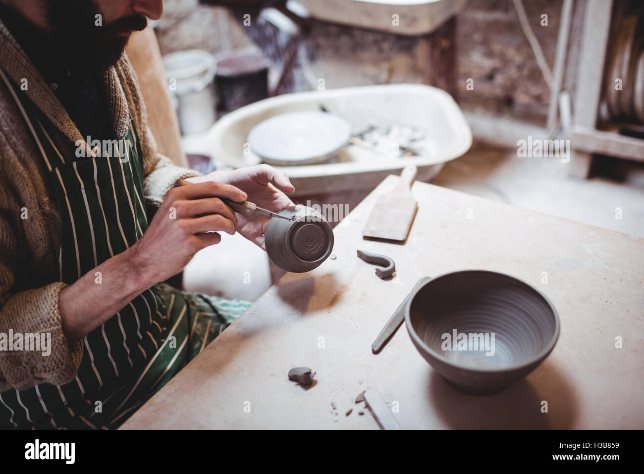 Bearded craftsman working Stock Photo - Alamy