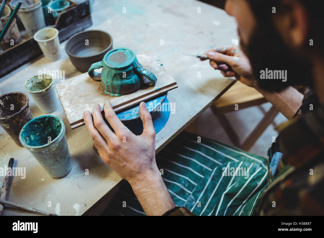 Man working at workshop Stock Photo - Alamy