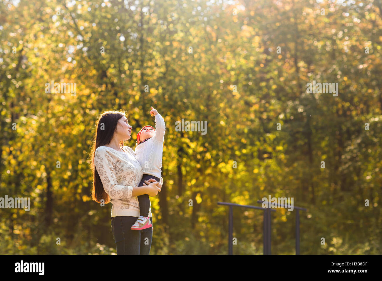 Beautiful lifestyle autumn photo mother and child walks evening in the ...